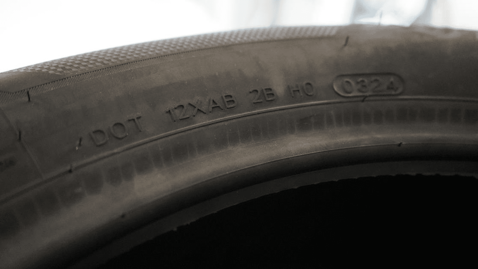AutoDOT: Automated DOT Code Verification for Tire Safety
